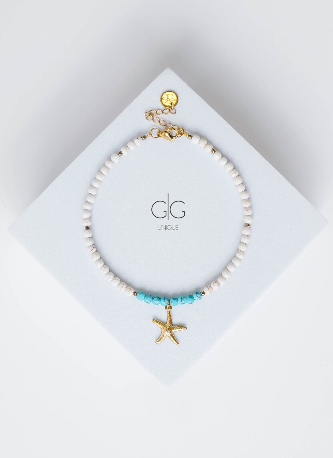 Sea star anklet with blue details in gold | GG UNIQUE